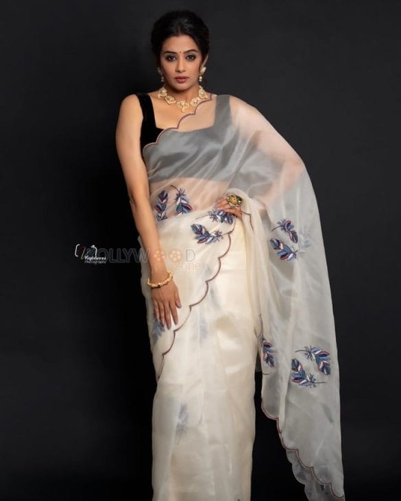 Glamorous Priyamani In A White Transparent Saree With Black Sleeveless ...