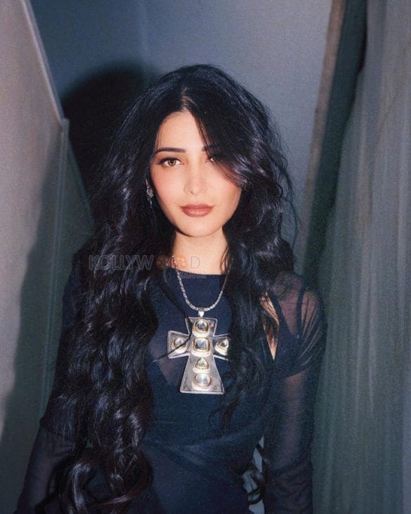 Fashionista Shruti Haasan In A Black Ruffle Maxi Dress With Thigh High Boots Photos 01 300548