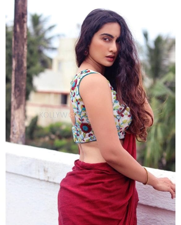 Hypnotic Megha Shukla In A Red Saree With Sleeveless Multi Coloured ...