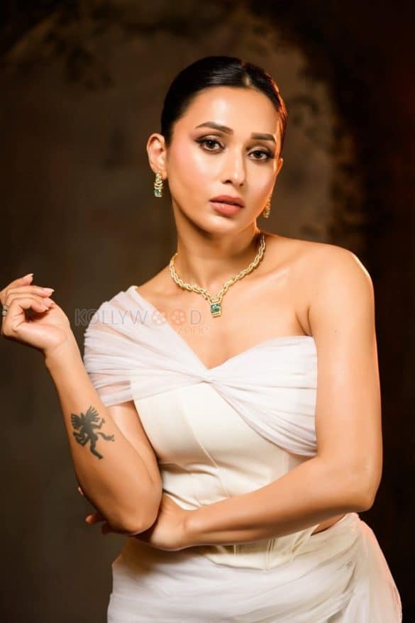 Elegant Actress Mimi Chakraborty In A White Off Shoulder Draped Saree ...